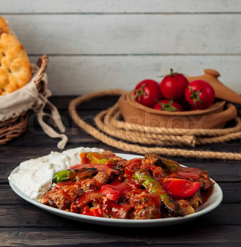 Iskender kebab garnished with tomato ... | Stock image | Colourbox