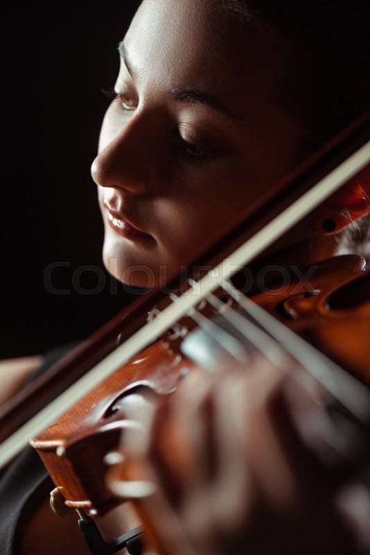 Beautiful professional musician playing ... | Stock image | Colourbox
