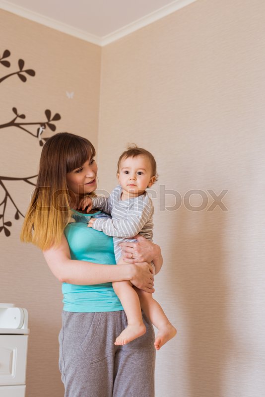 Portrait of mother and baby legs. First ... | Stock image | Colourbox