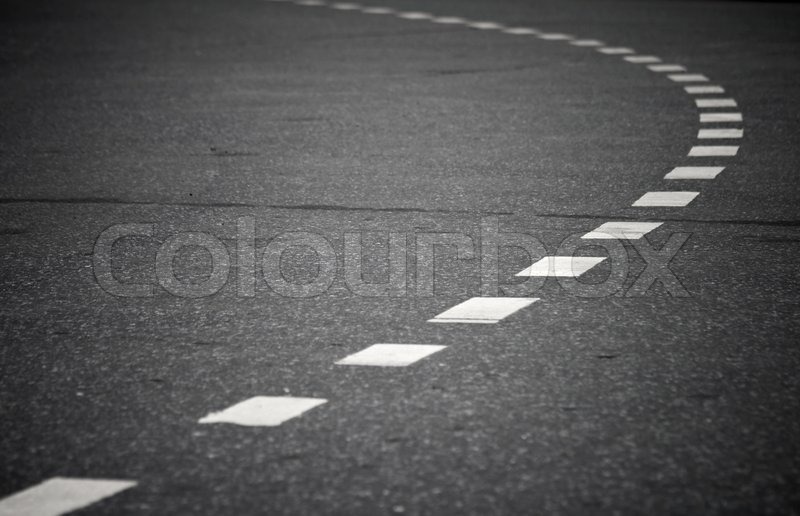 Turning asphalt road with marking lines ... | Stock Photo | Colourbox