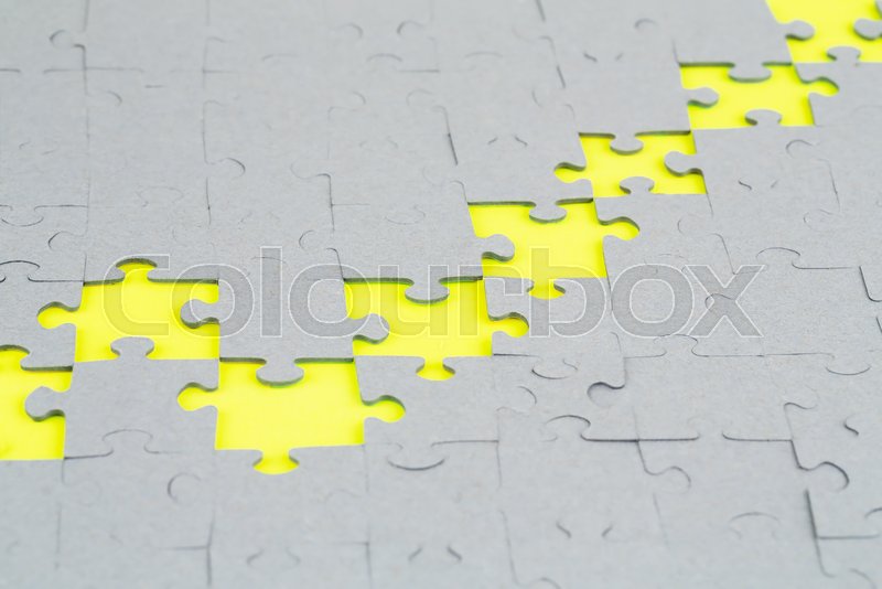 Unfinished jigsaw puzzle pieces on ... | Stock image | Colourbox