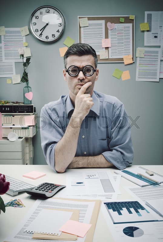 Pensive nerd businessman at office with ... | Stock image | Colourbox