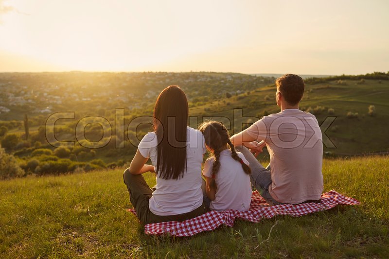 Back view of young family with child ... | Stock image | Colourbox