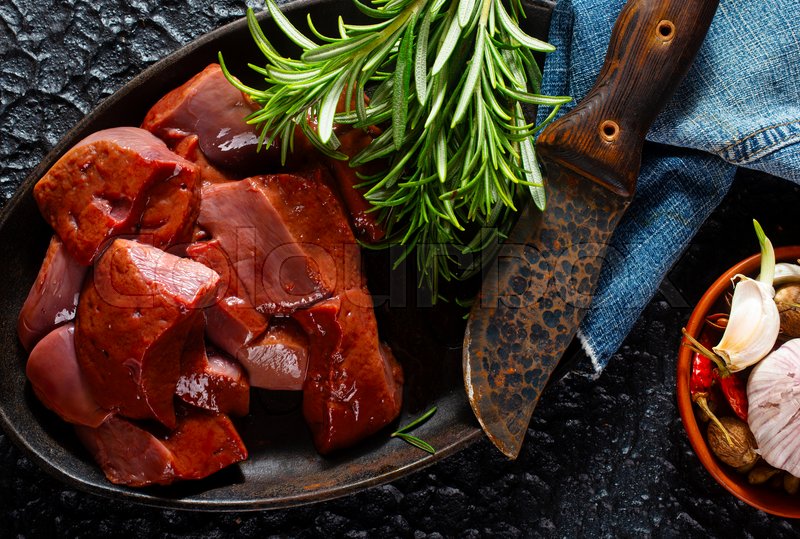 Raw liver on metal plate. Ready to ... | Stock image | Colourbox
