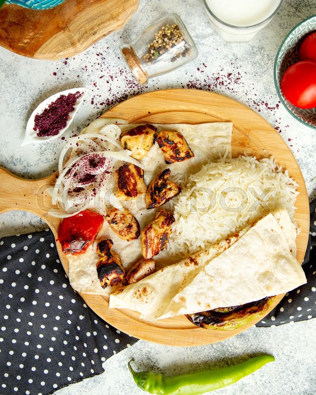 Top view of chicken kebab served with ... | Stock image | Colourbox