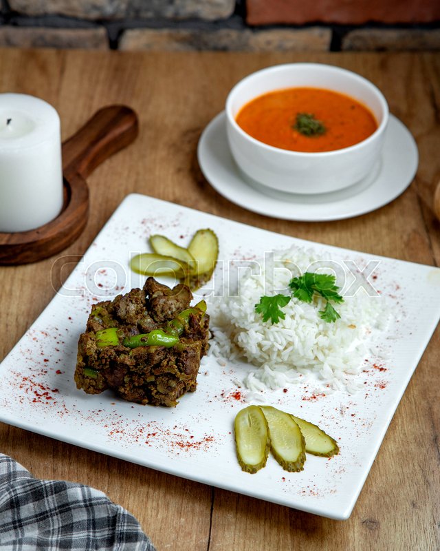 A plate of rice dish served with meat ... | Stock image | Colourbox