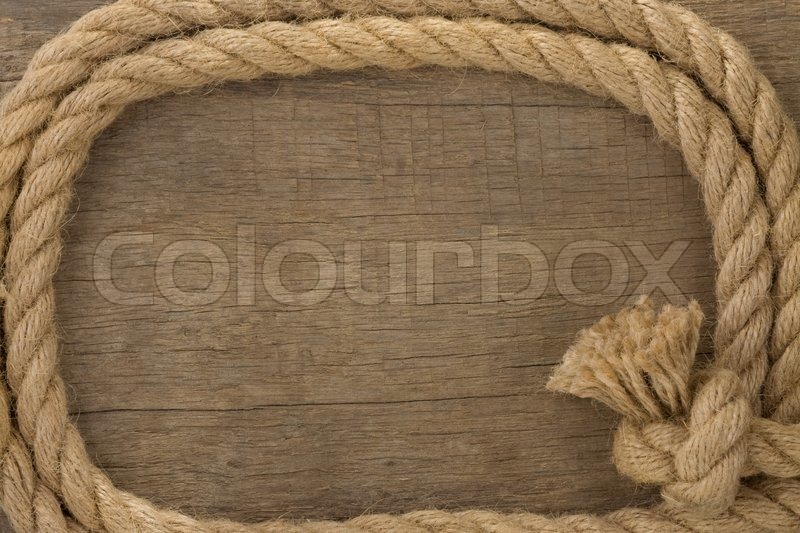 Ship ropes borders on wood background | Stock image | Colourbox