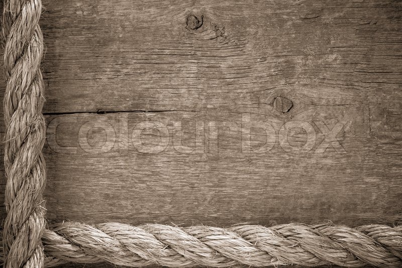 Ship ropes borders on wood background | Stock image | Colourbox