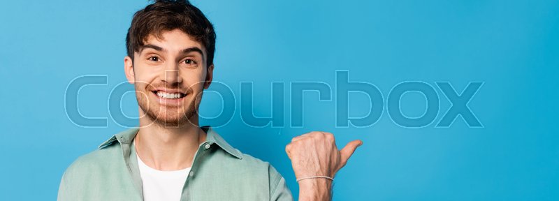 Horizontal image of happy young man ... | Stock image | Colourbox