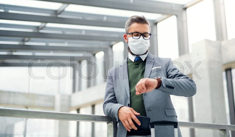 Portrait of businessman with face mask ... | Stock image | Colourbox