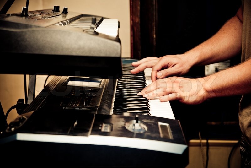 Musician playing synthesizer | Stock image | Colourbox