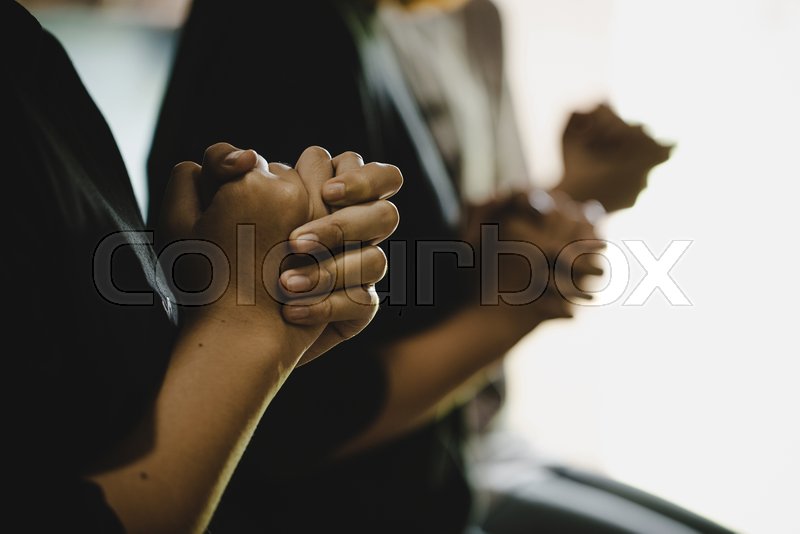 Three people pray and praising God ... | Stock image | Colourbox