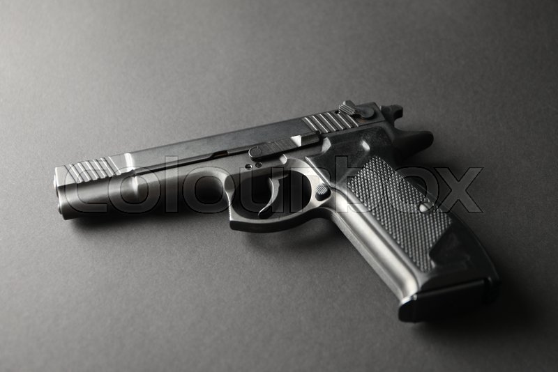 Pistol on black background. Self ... | Stock image | Colourbox