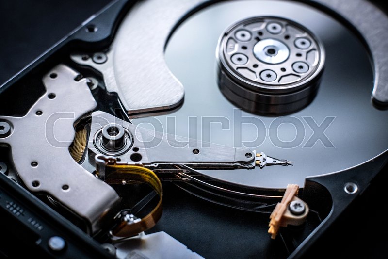 Closeup of head cylinder in hard disk ... | Stock image | Colourbox