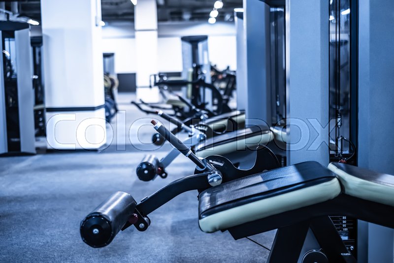 Leg trainer equipment in atletic gym | Stock image | Colourbox