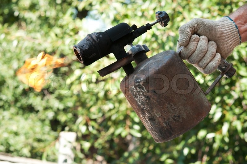 Man with blowtorch | Stock image | Colourbox