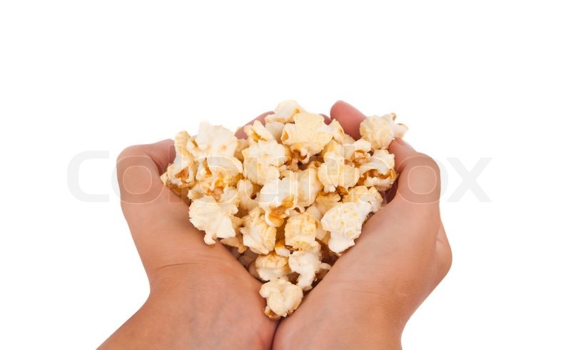 Popcorn in hand isolated | Stock image | Colourbox