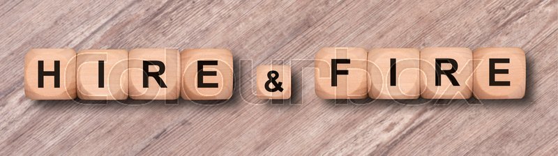 Hire & fire written on wooden cubes | Stock image | Colourbox