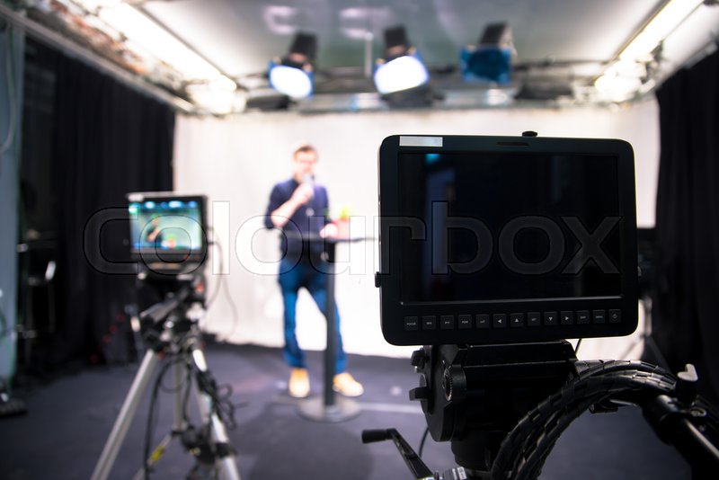 Journalist in a television studio is ... | Stock image | Colourbox