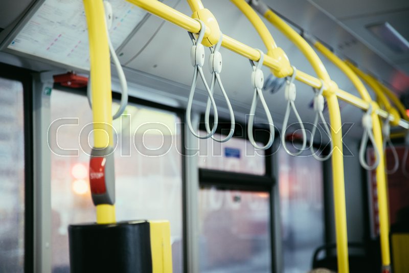 Hold on straps in a bus, commuting, ... | Stock image | Colourbox
