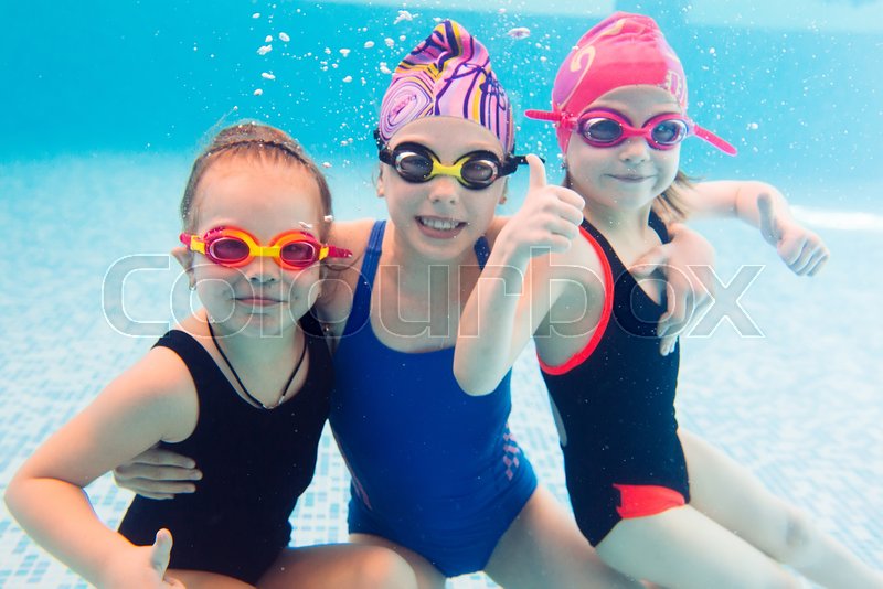 Underwater photo of young friends in ... | Stock image | Colourbox