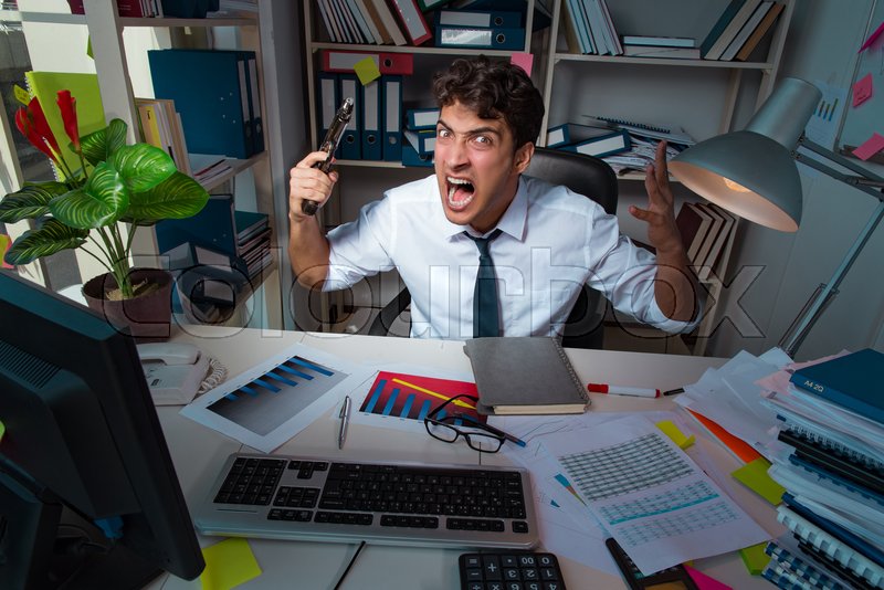 Man businessman working late hours in ... | Stock image | Colourbox