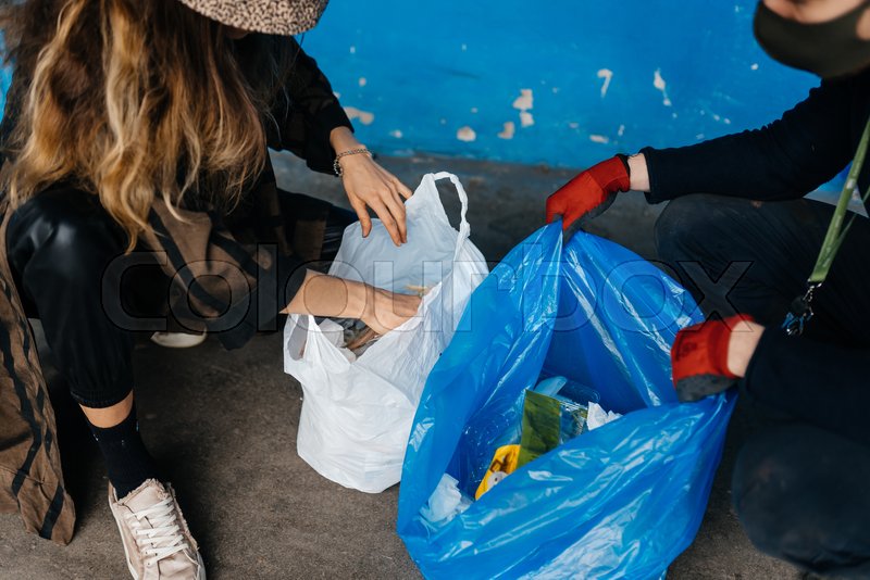 Two young women sorting garbage. ... | Stock image | Colourbox
