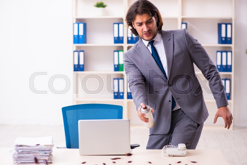 Young male employee and too many ... | Stock image | Colourbox