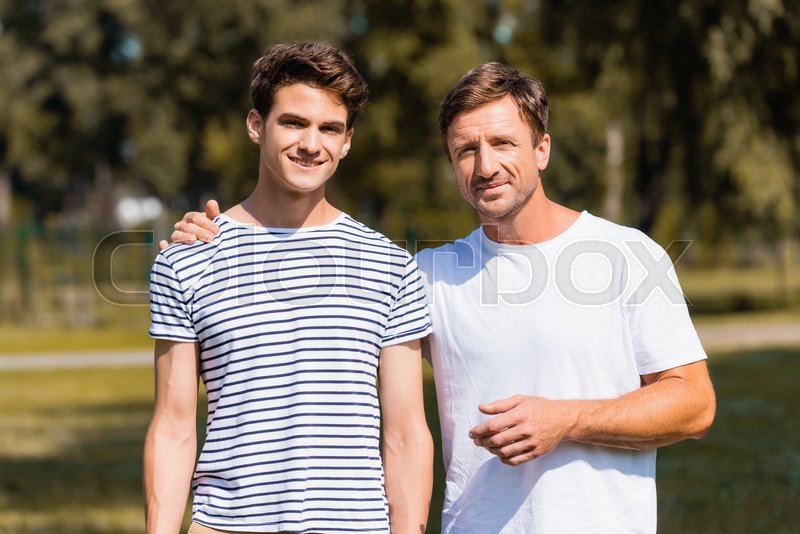 Father And Teenage Son Hugging
