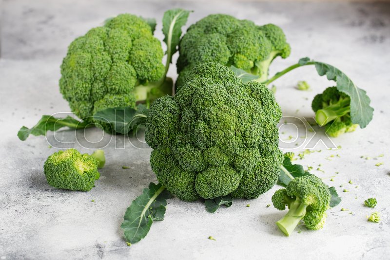 Fresh green broccoli on a light grey ... | Stock image | Colourbox