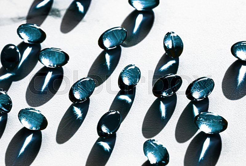 Blue herbal capsules for healthy diet ... | Stock image | Colourbox