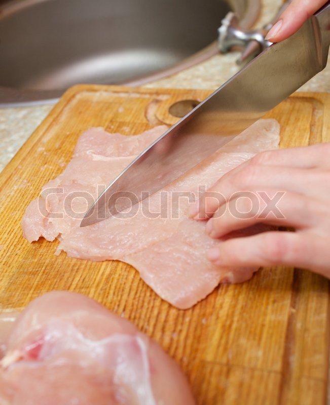 Cutting chicken meat | Stock image | Colourbox