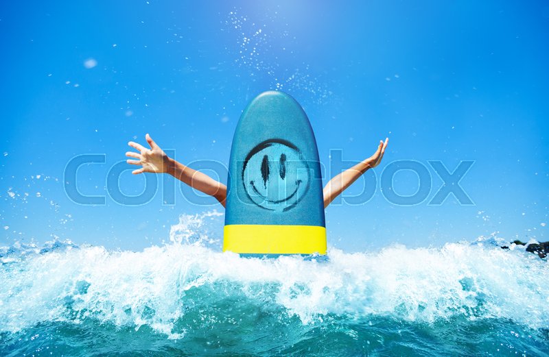 Surfboard with smile face on it, waves ... | Stock image | Colourbox