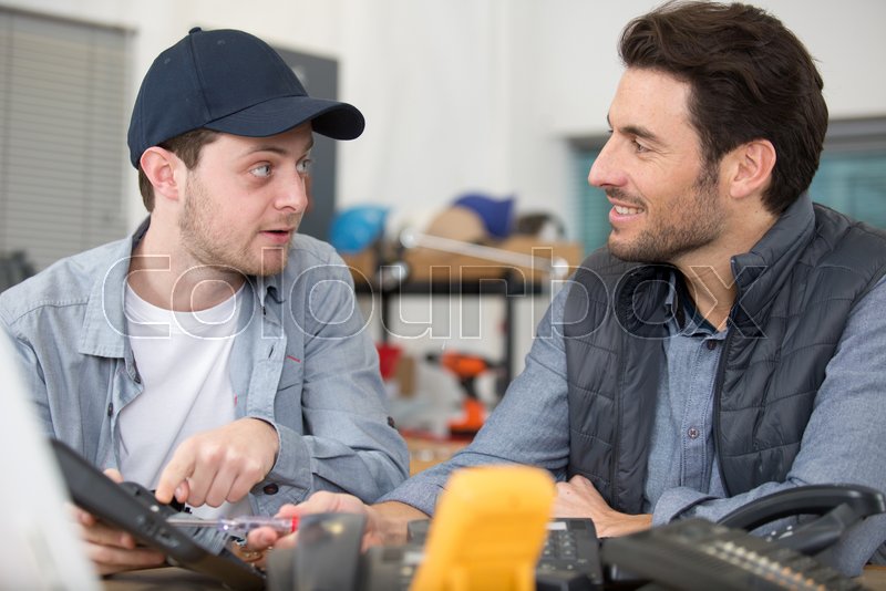 Two male engineers in discussion in ... | Stock image | Colourbox