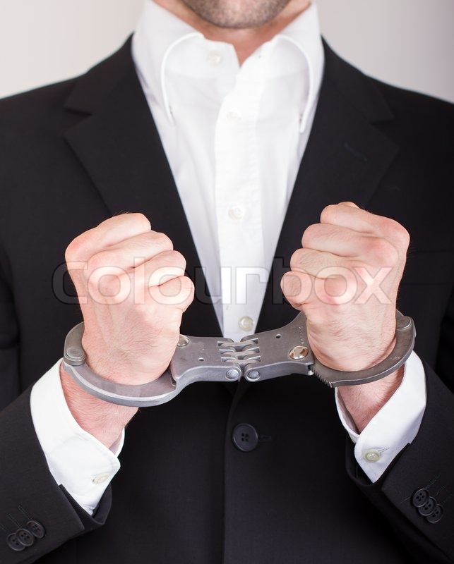 Man with handcuffs, business suit, ... | Stock image | Colourbox