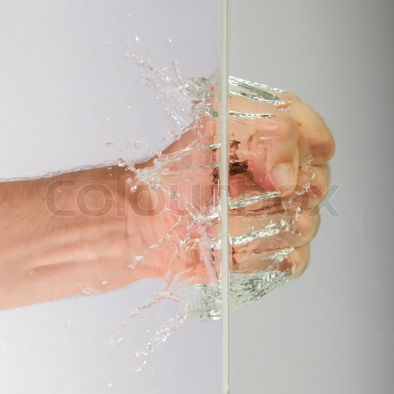 Hand fist with splashing water | Stock image | Colourbox