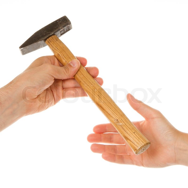 Man giving a woman an used hammer | Stock image | Colourbox