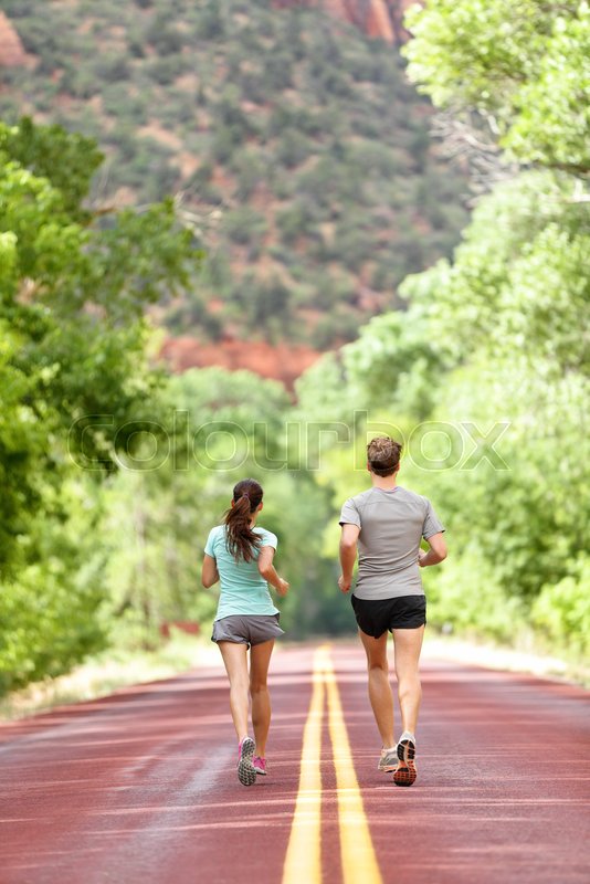 Runners running on road in nature away ... | Stock image | Colourbox