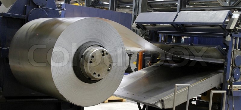 Roll of steel mounted on a slitter | Stock image | Colourbox