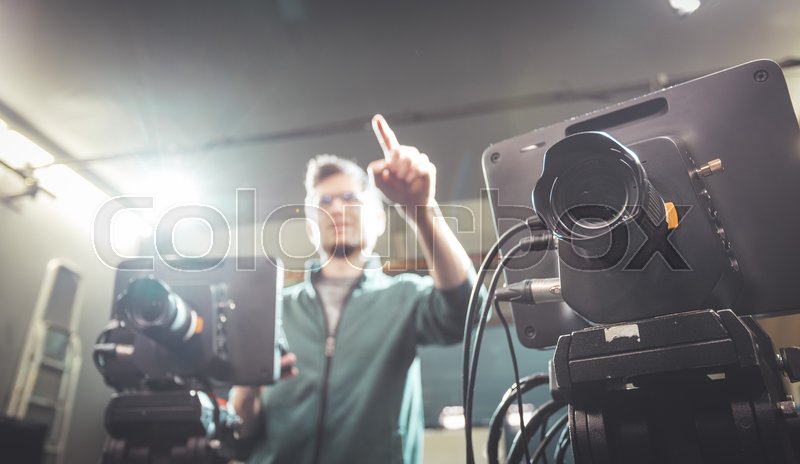 Male cameraman is operating a film ... | Stock image | Colourbox