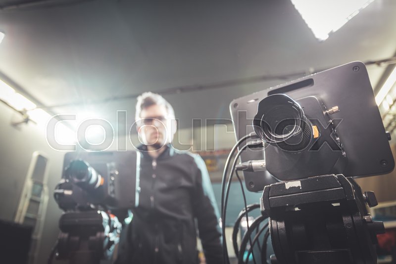 Male cameraman is operating a film ... | Stock image | Colourbox