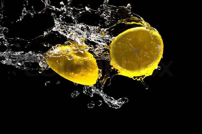 Lemon splash on black background | Stock image | Colourbox