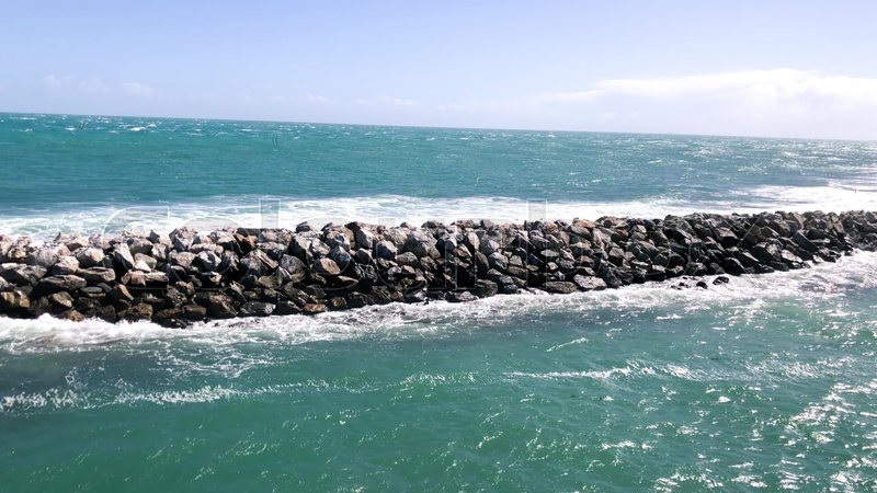 Aligned rocks along the shoreline, sea ... | Stock video | Colourbox