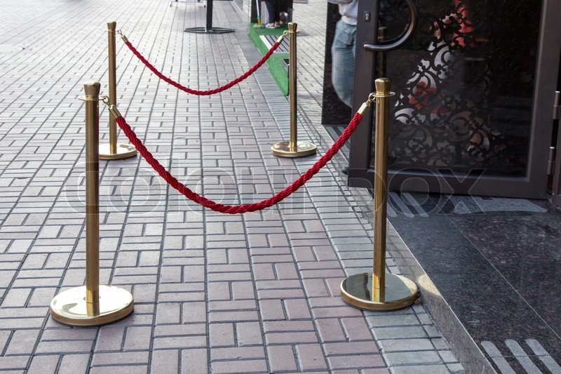 Stanchions with red barrier rope | Stock image | Colourbox