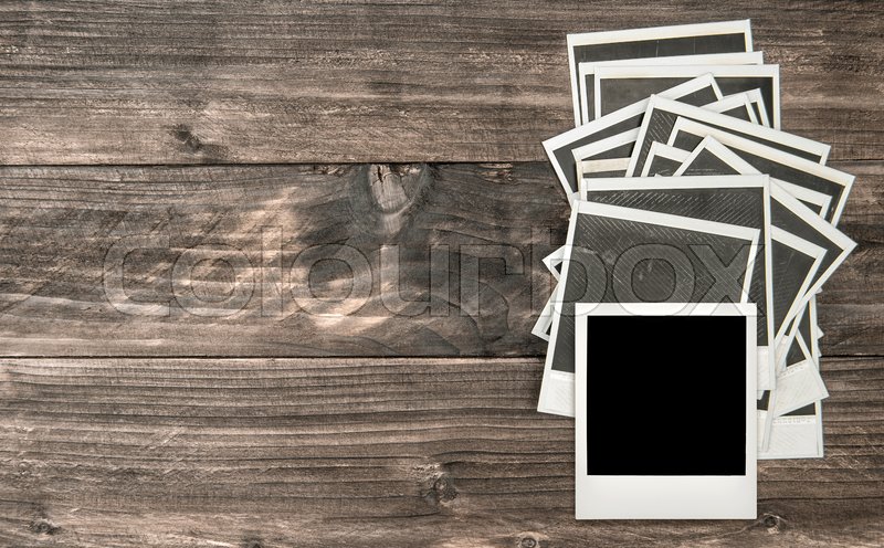 Old instant photo frames on rustic ... | Stock image | Colourbox