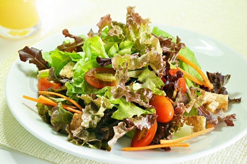 Fresh salad on white background | Stock image | Colourbox