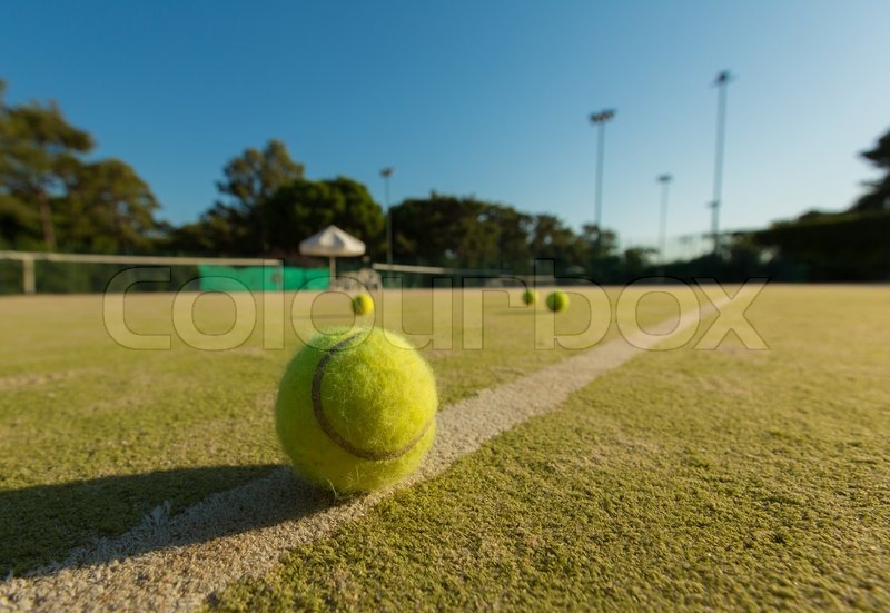 Tennis ball on a line | Stock image | Colourbox