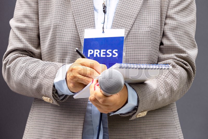 News Journalist Taking Notes