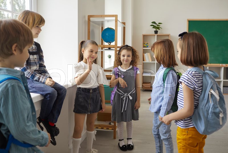 Group Of Kids Talking In Classroom