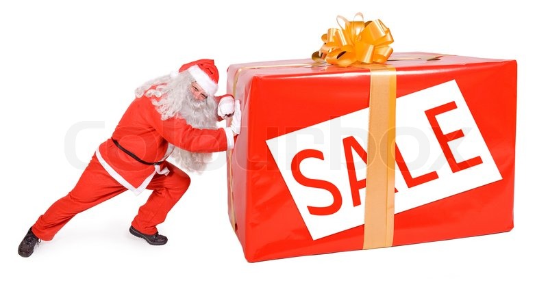 Santa Claus pushing at a big gift | Stock image | Colourbox